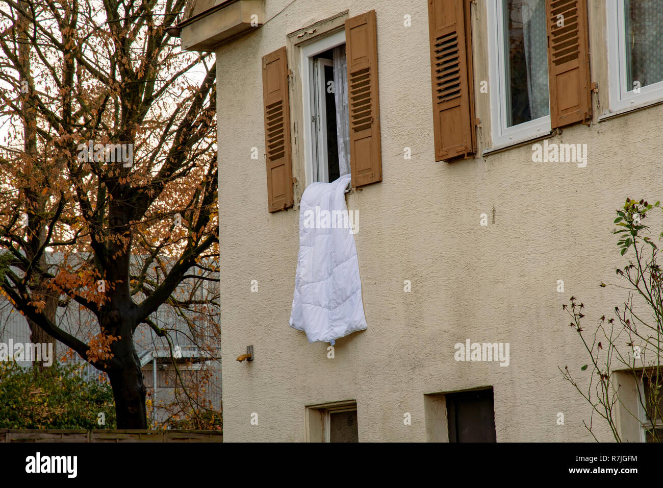 Clothes hanging out window house hi-res stock photography and images ...