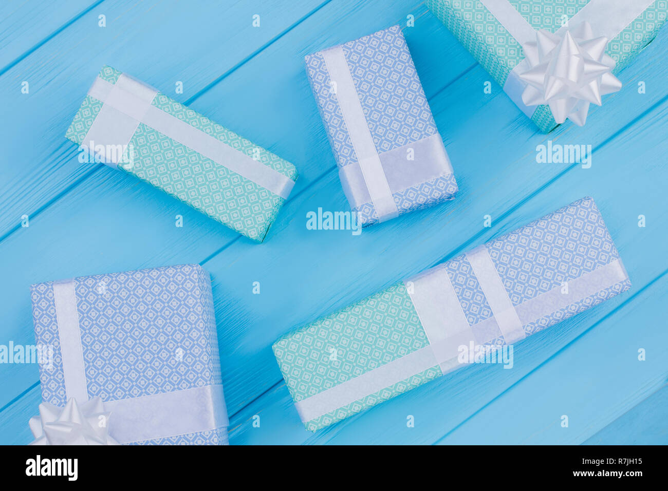 Many gift boxes, flat lay. Blue wood background Stock Photo - Alamy