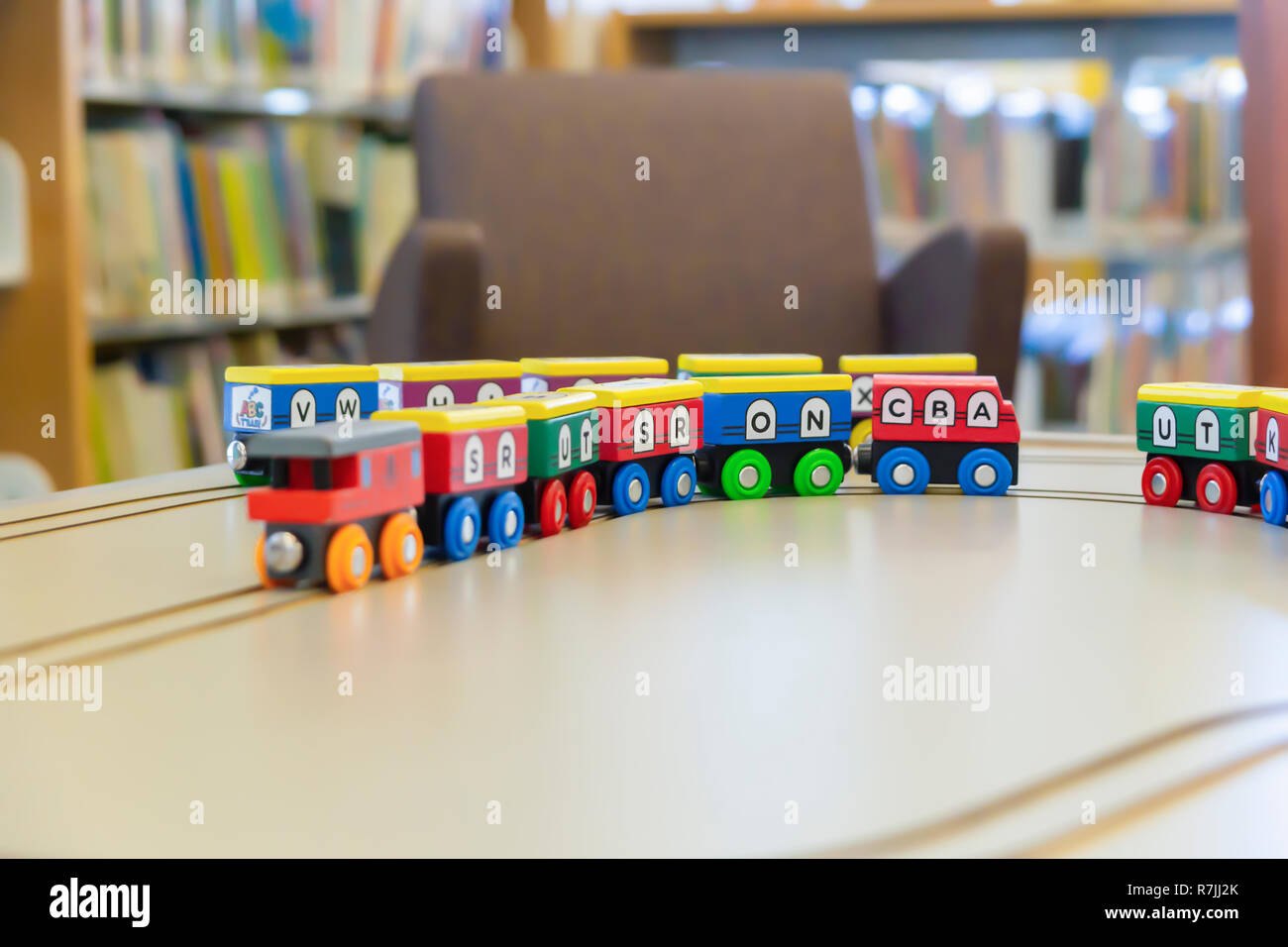 A colorful train with letters of the alphabet and numbers painted all ...