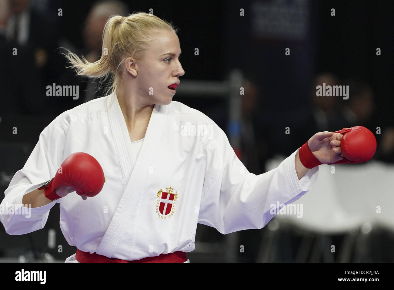Women karate contestants compete in the elimination round of Kumite by ...
