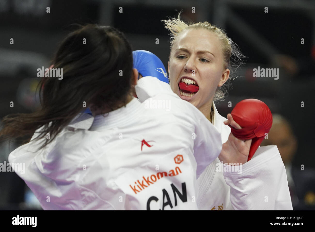 Women karate contestants compete in the elimination round of Kumite by ...