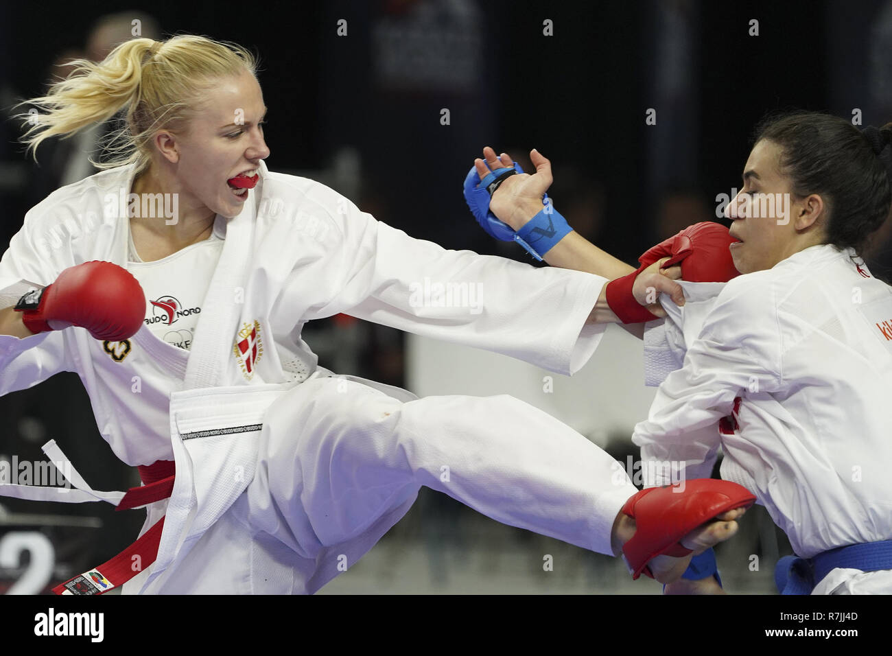 Women karate contestants compete in the elimination round of Kumite by ...