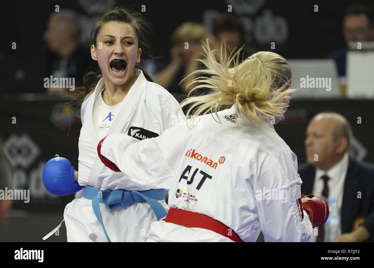 Women karate contestants compete in the elimination round of Kumite by ...