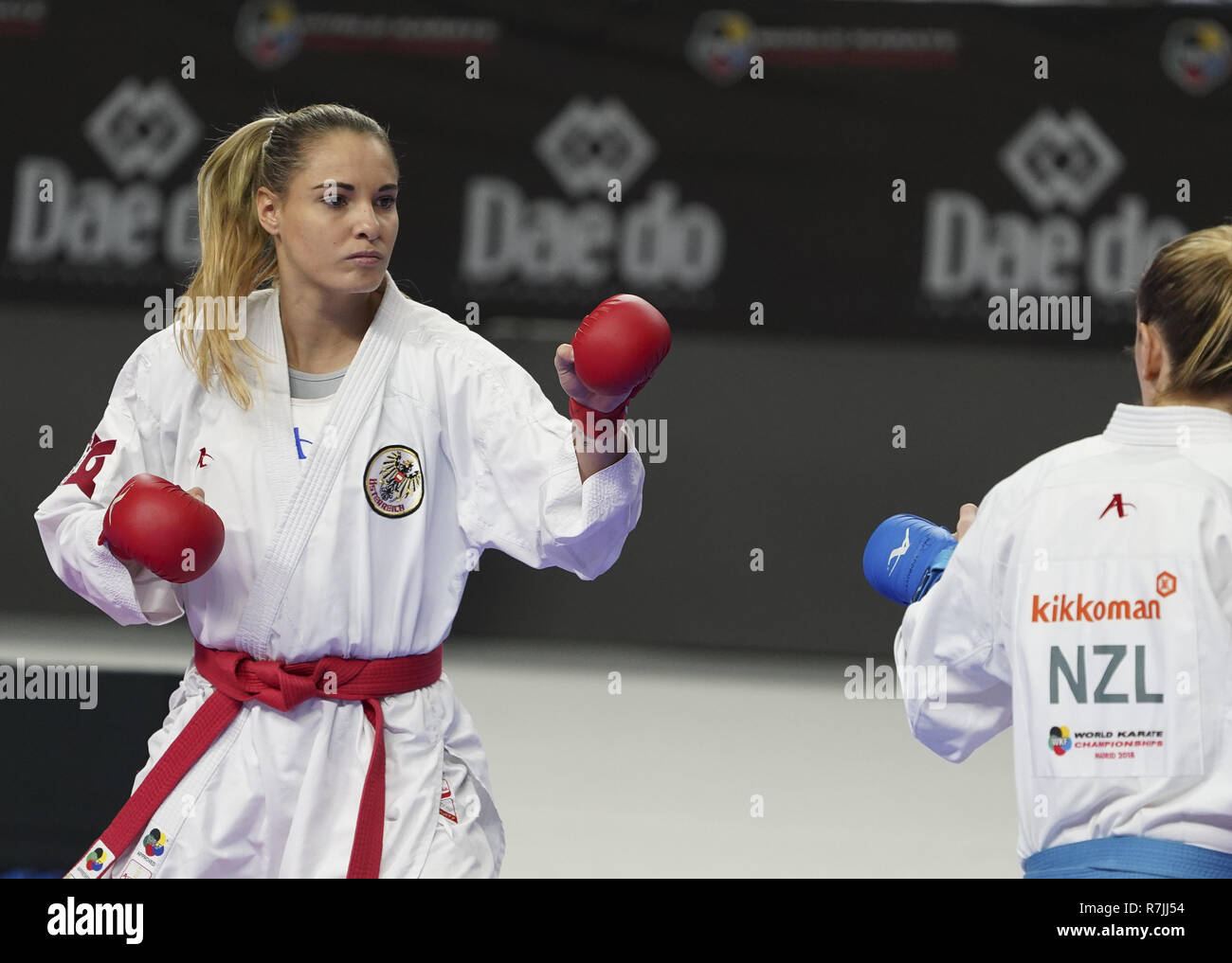Women karate contestants compete in the elimination round of Kumite by ...