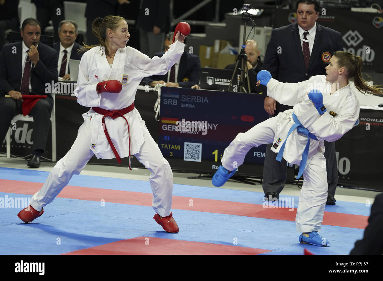 Women karate contestants compete in the elimination round of Kumite by ...