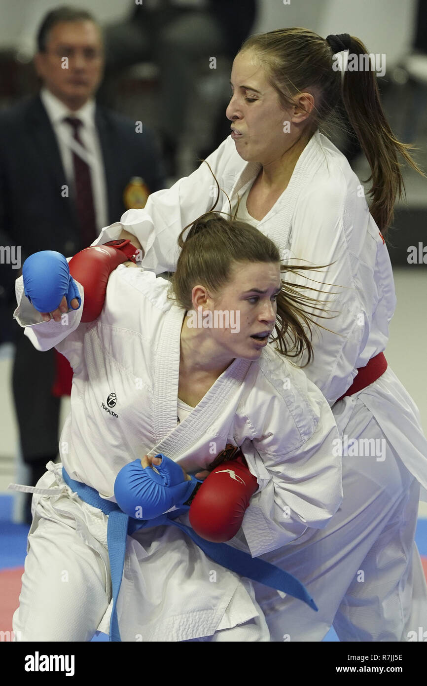 Women karate contestants compete in the elimination round of Kumite by ...