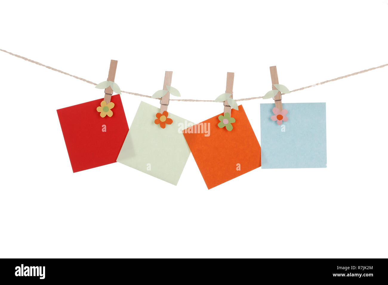 Blank paper cards hanging on clothespins Stock Photo - Alamy