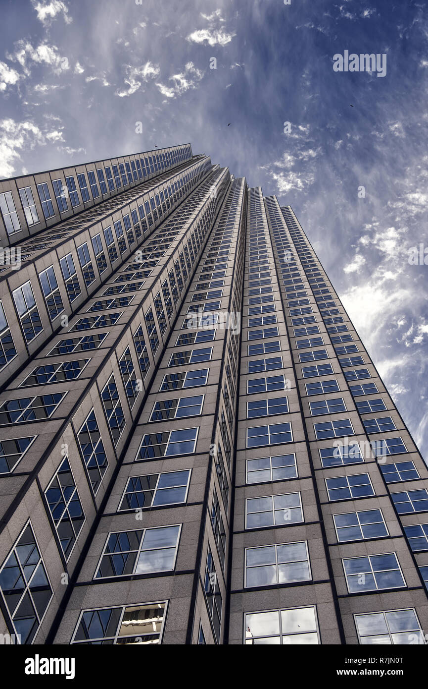 perspective wide angle view to steel blue background of glass high rise ...