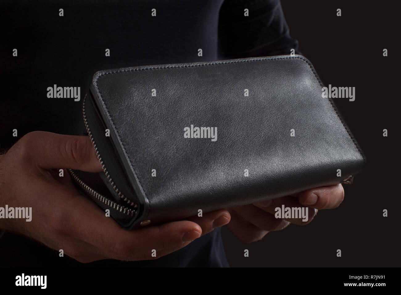 black purse in male hands Stock Photo - Alamy
