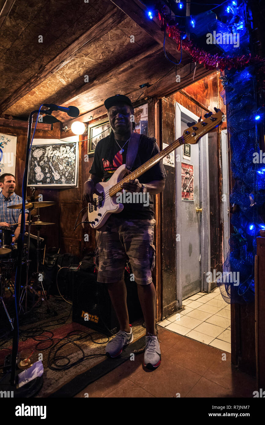 New York City, USA - July 29, 2018: Bass guitarist playing with its ...