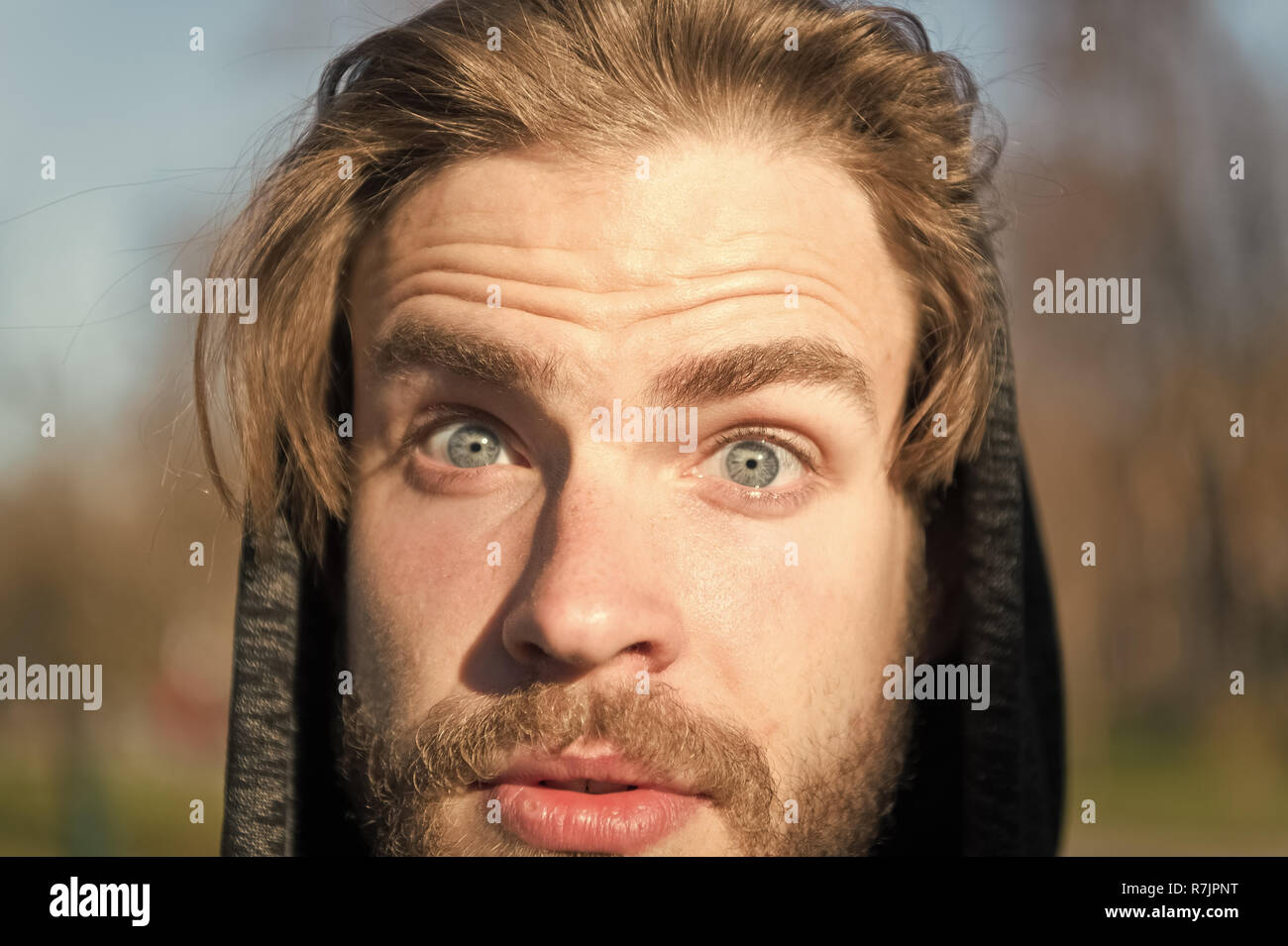 Man with mustache on surprised face, male beauty. Macho with blond hair ...