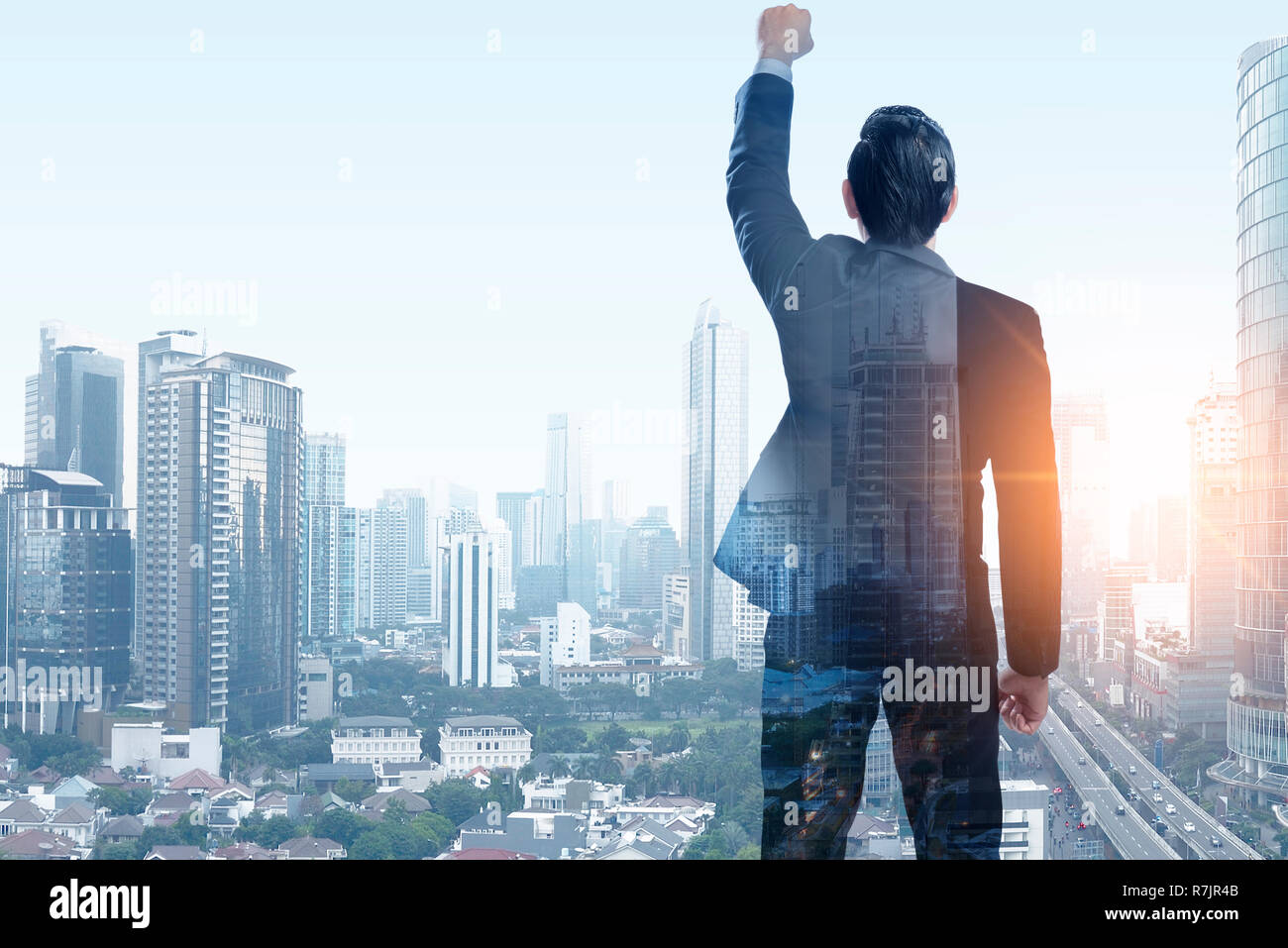 Black businessman raised arm hi-res stock photography and images - Alamy