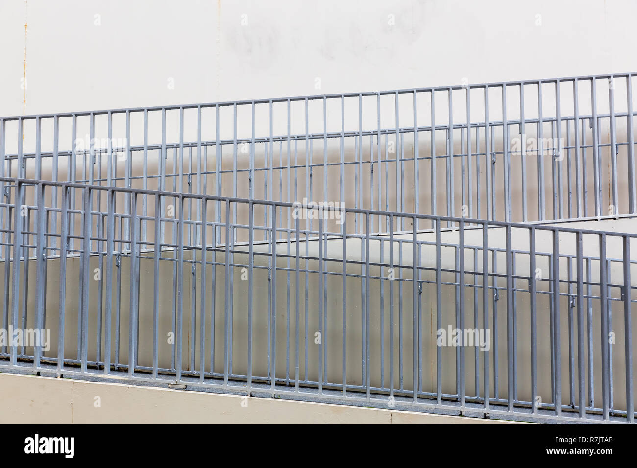 picture of handrails which lead upwards at a concrete wall Stock Photo ...
