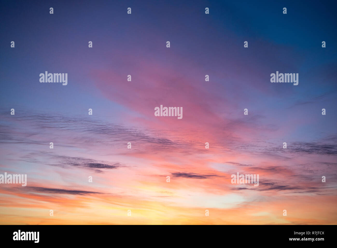 Beautiful sunset, clouds in many colors Stock Photo - Alamy