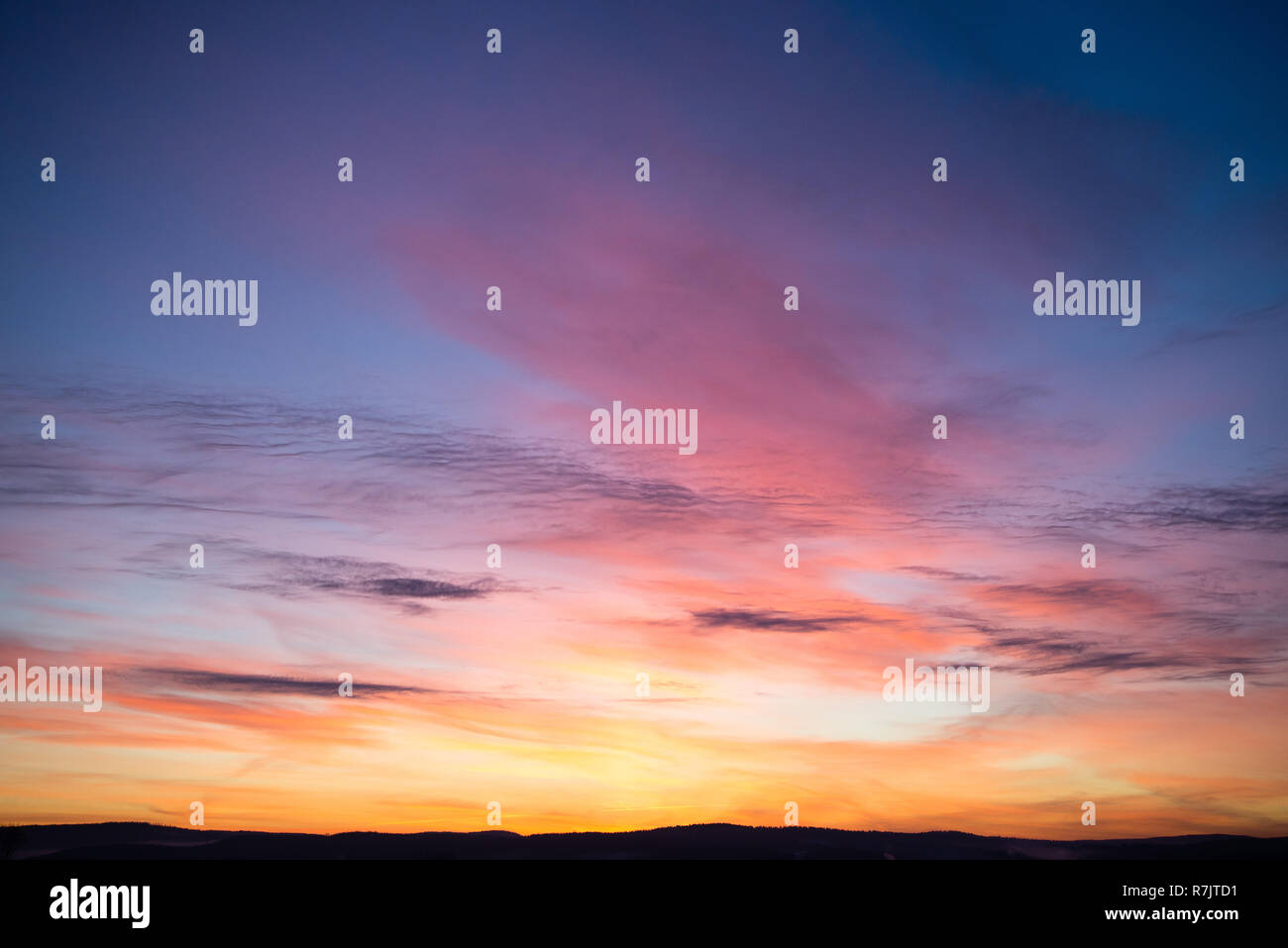 Beautiful sunset, clouds in many colors Stock Photo - Alamy