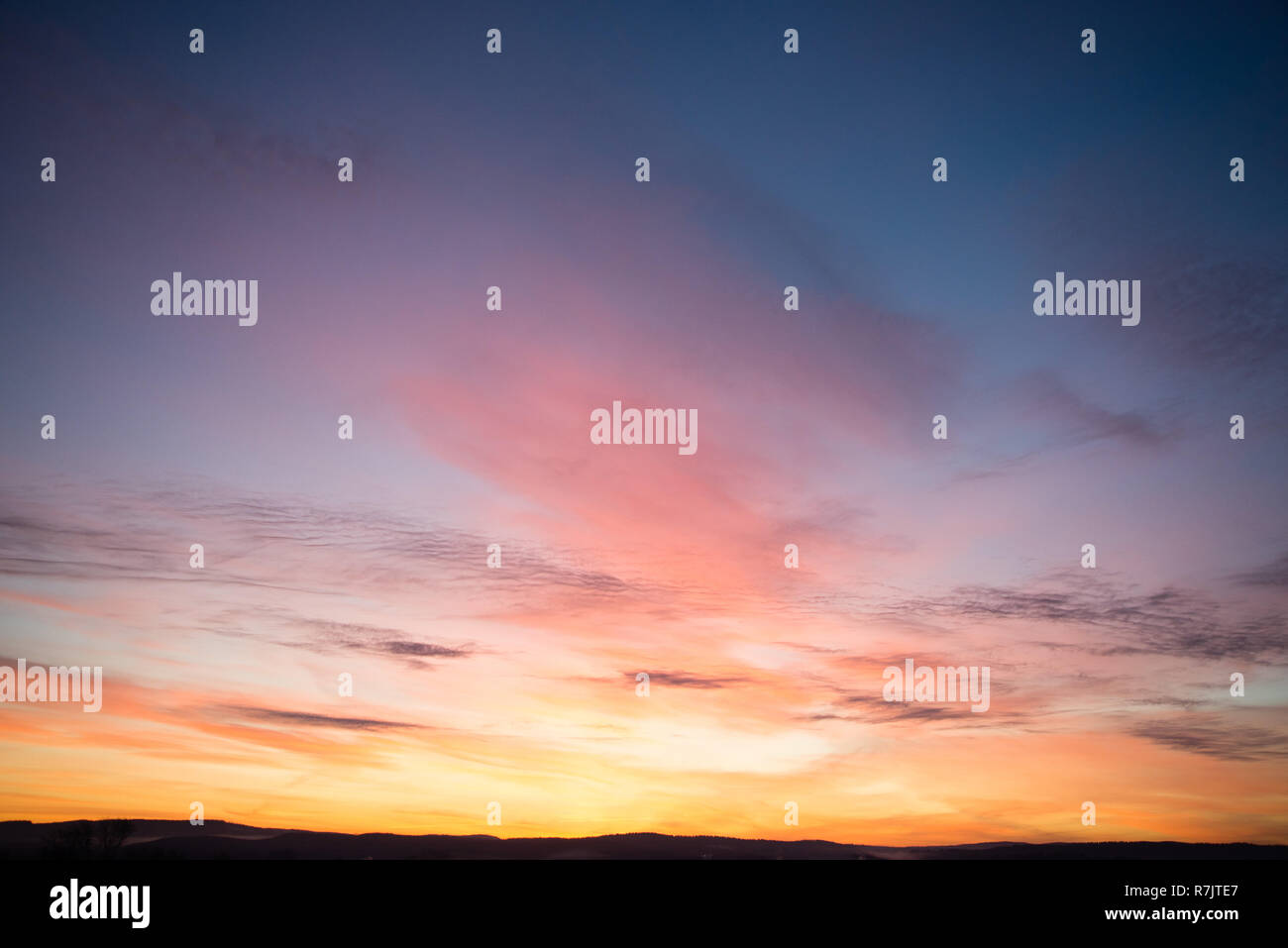 Beautiful sunset, clouds in many colors Stock Photo - Alamy