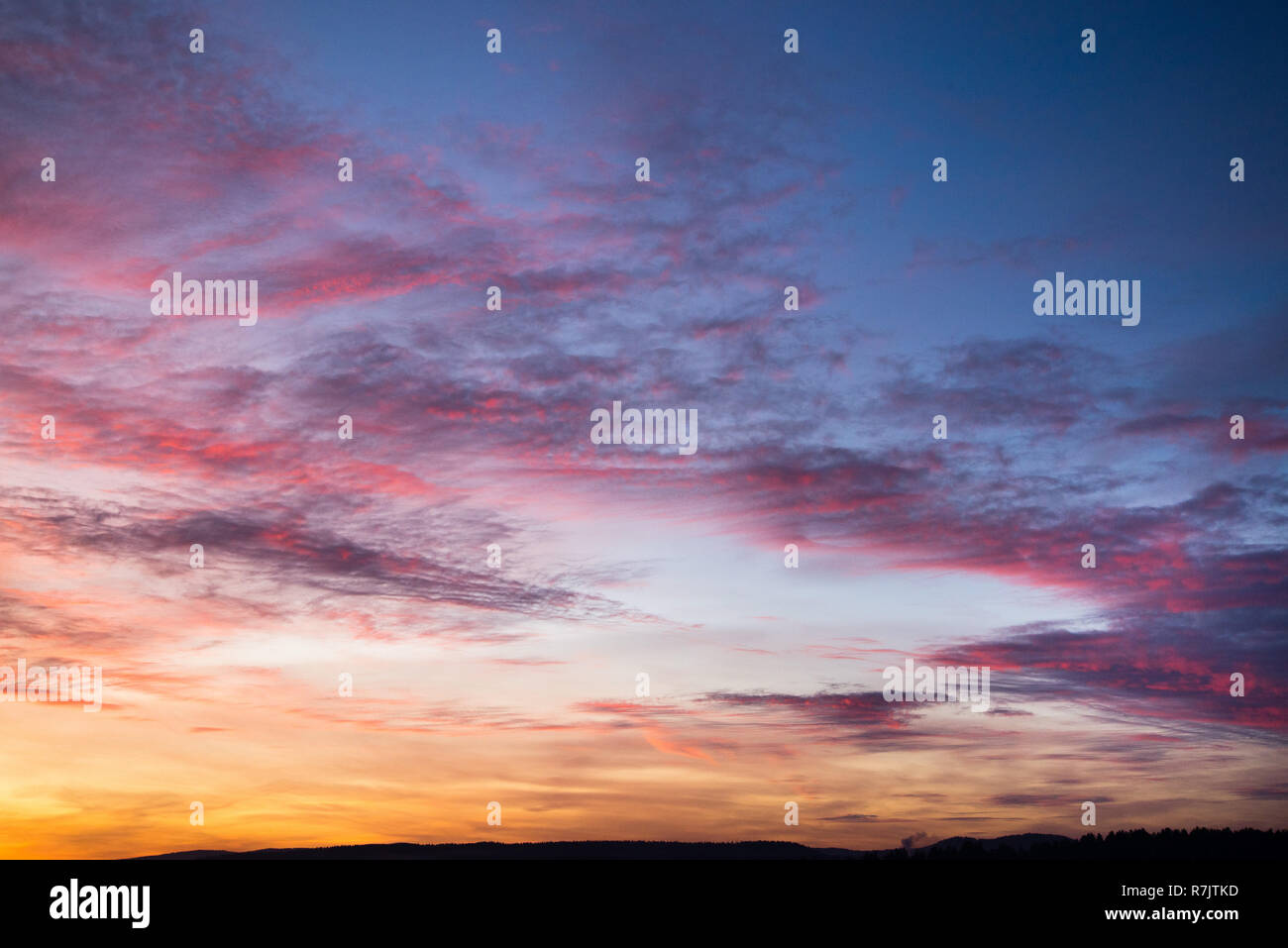 Beautiful sunset, clouds in many colors Stock Photo - Alamy