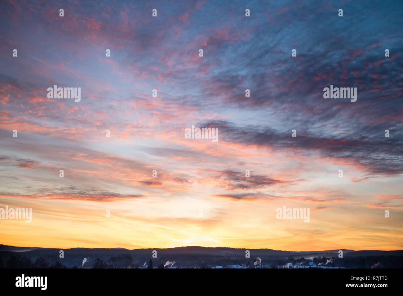 Beautiful sunset, clouds in many colors Stock Photo - Alamy