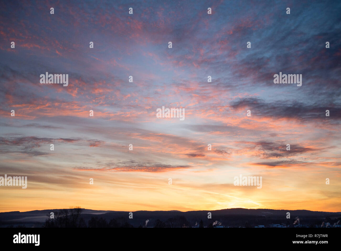 Beautiful sunset, clouds in many colors Stock Photo - Alamy