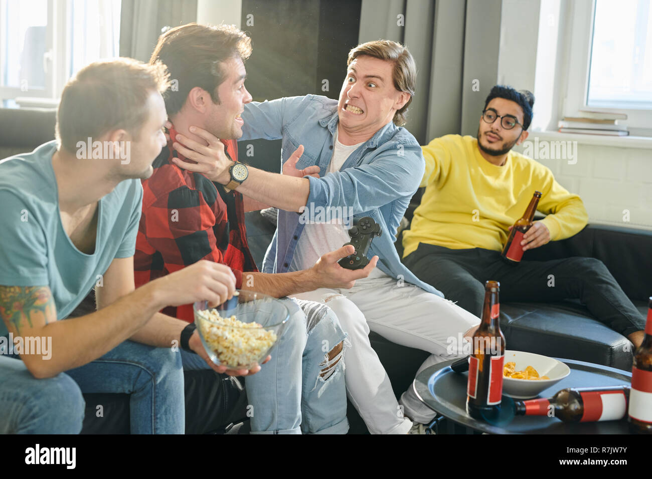 Young man is angry because he is losing on video game Stock Photo - Alamy