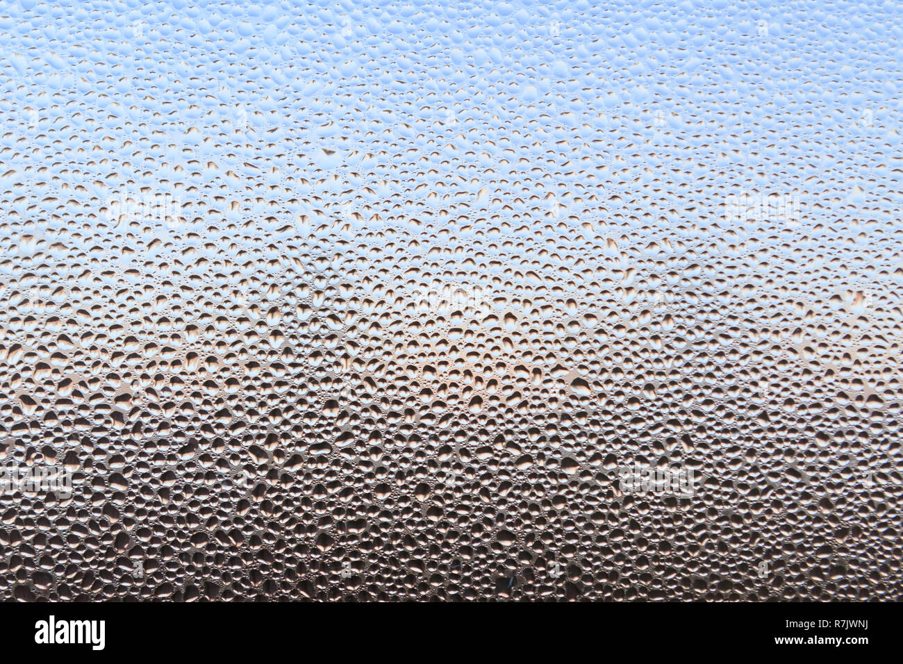 The frozen drops on the patterned frosty winter window Stock Photo - Alamy