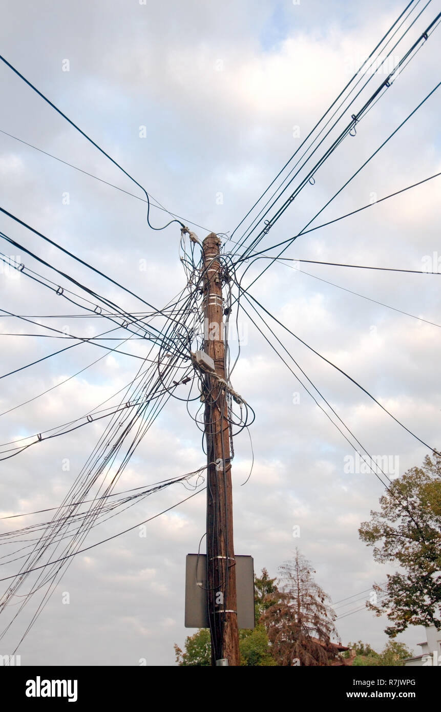 Telephone pole with tangled cables, Bucharest, Romania Stock Photo - Alamy