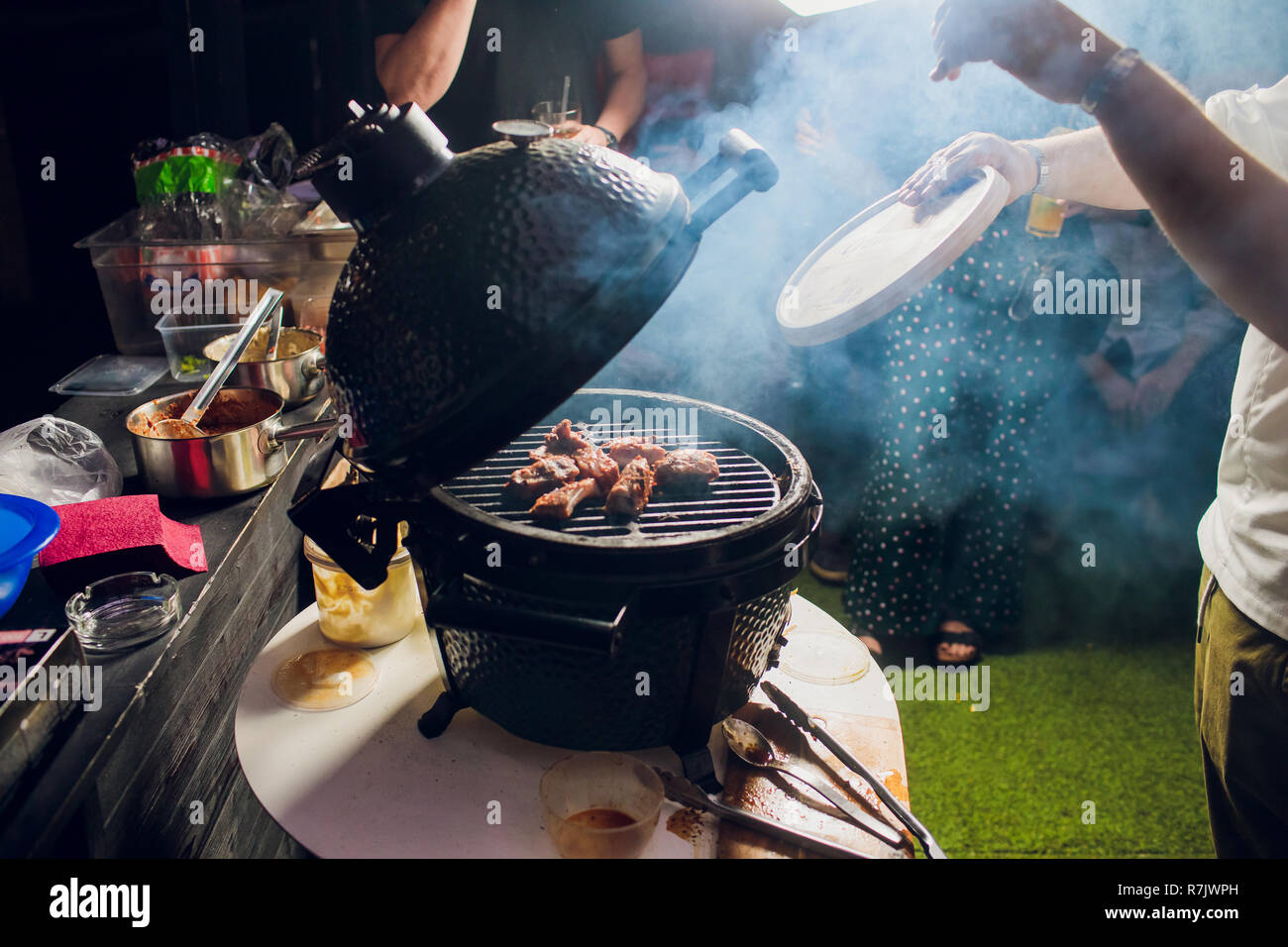 Dinner party, barbecue and roast pork night Stock Photo - Alamy