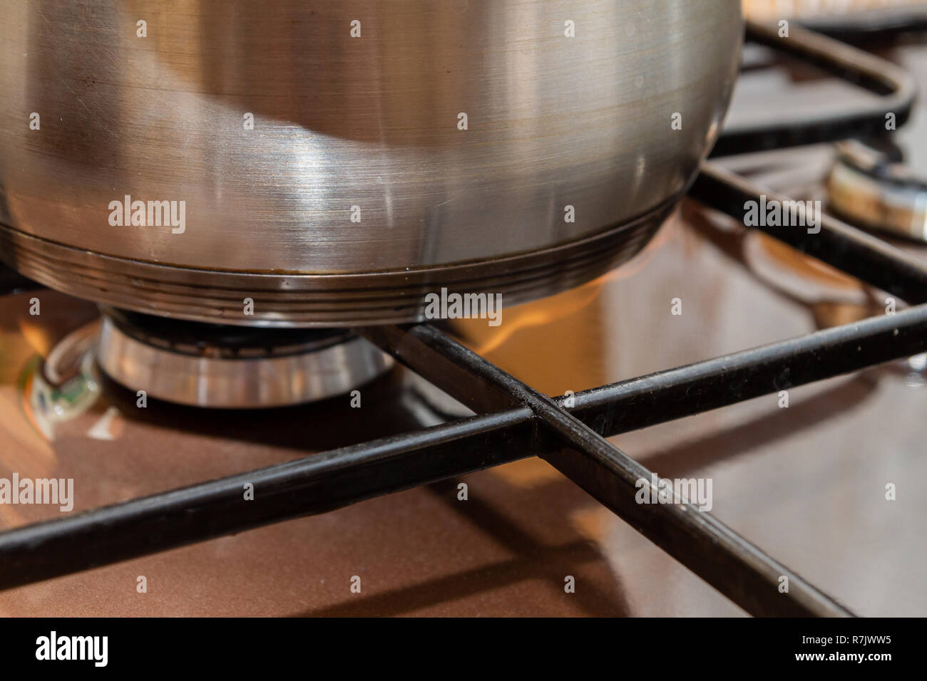 The pan is made of metal standing on a gas stove Stock Photo - Alamy