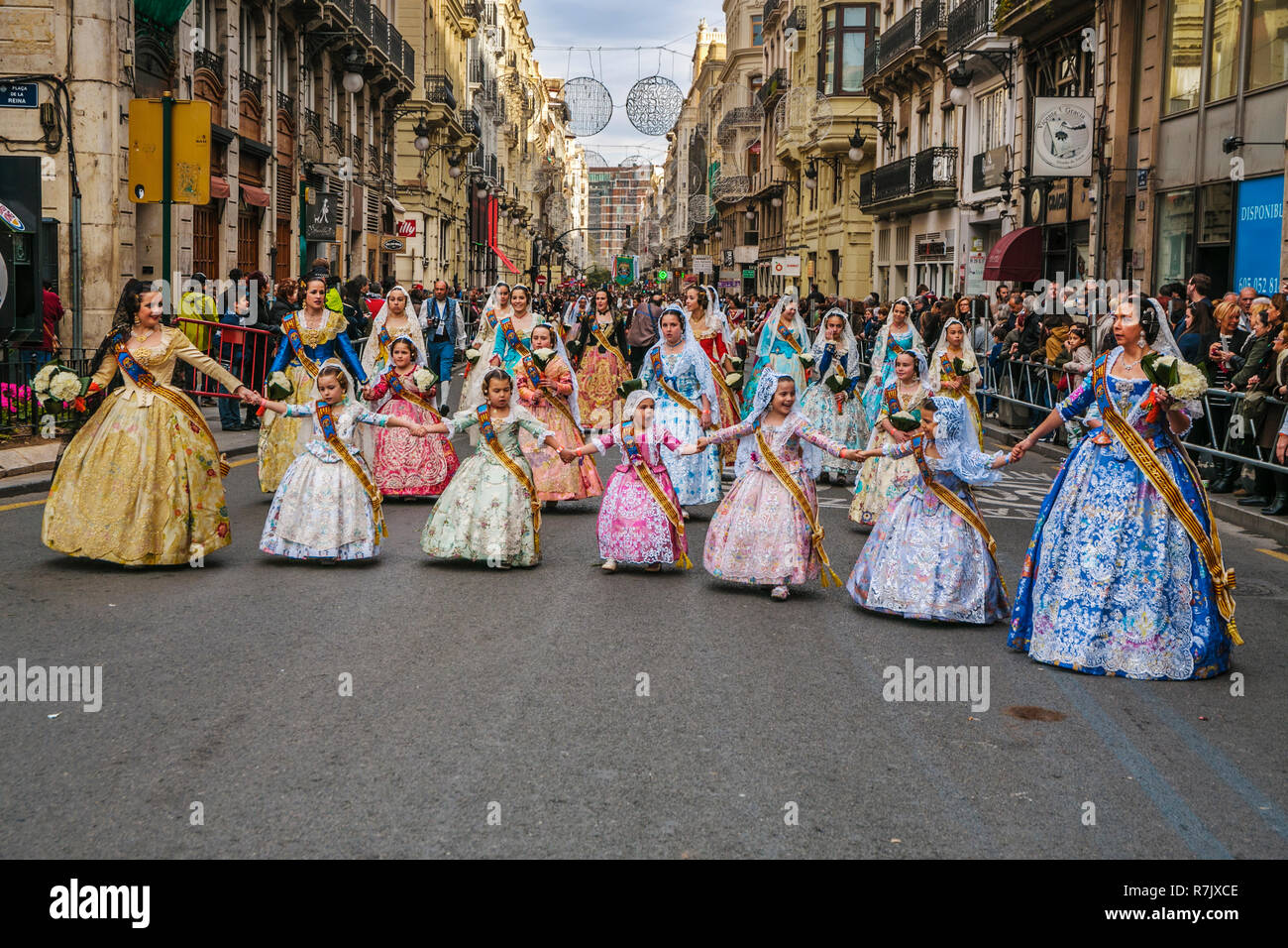 Fallas festival.Falleras parade offering flowers to the Virgin ...