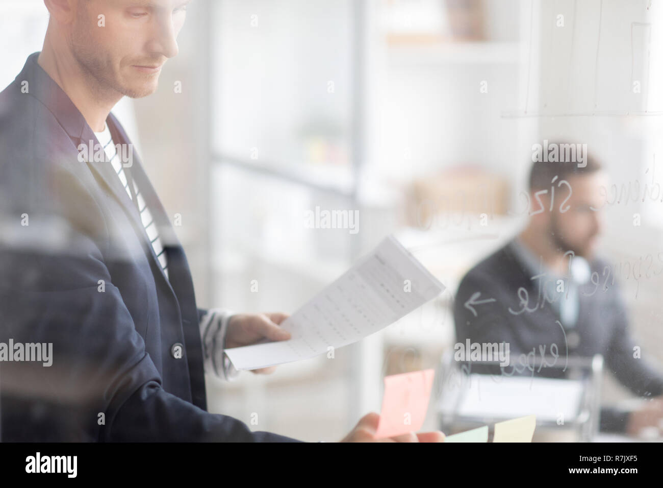 Standing behind glass hi-res stock photography and images - Alamy