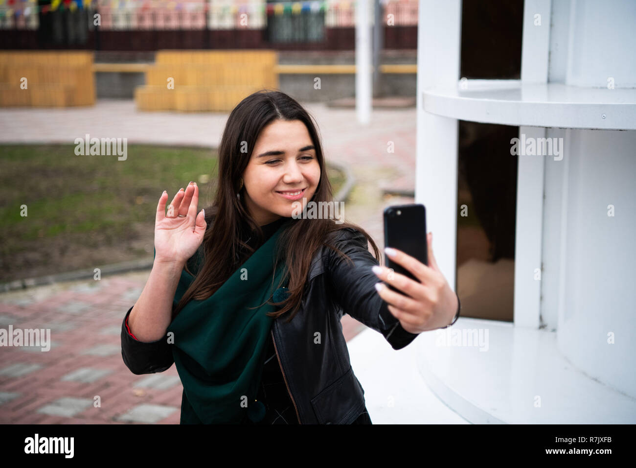 Woman making video call on cellphone at outdoor Stock Photo - Alamy