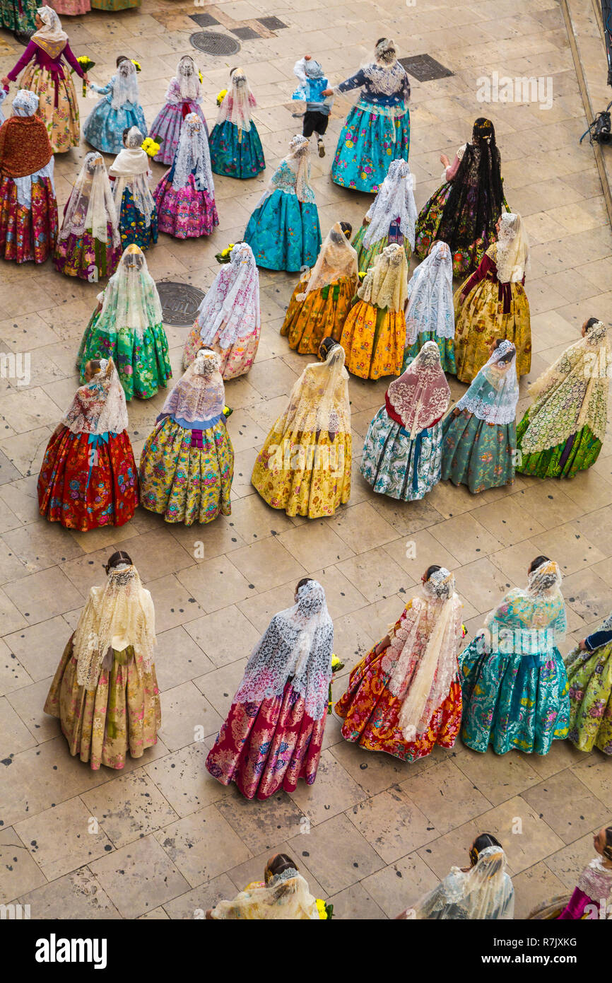 Fallas festival.Falleras parade offering flowers to the Virgin ...