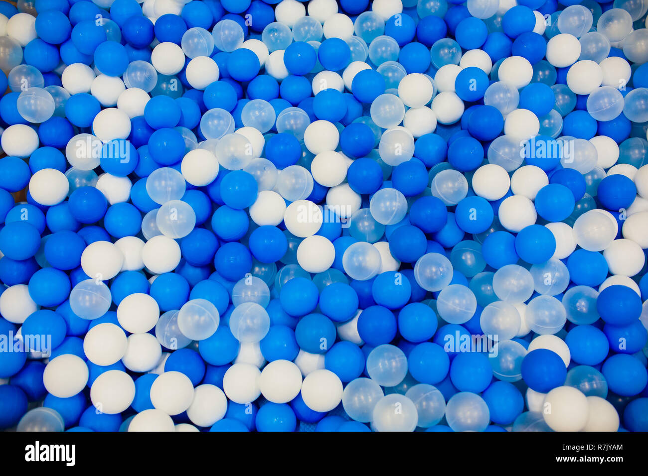 blue balls for kids playground play park Stock Photo - Alamy