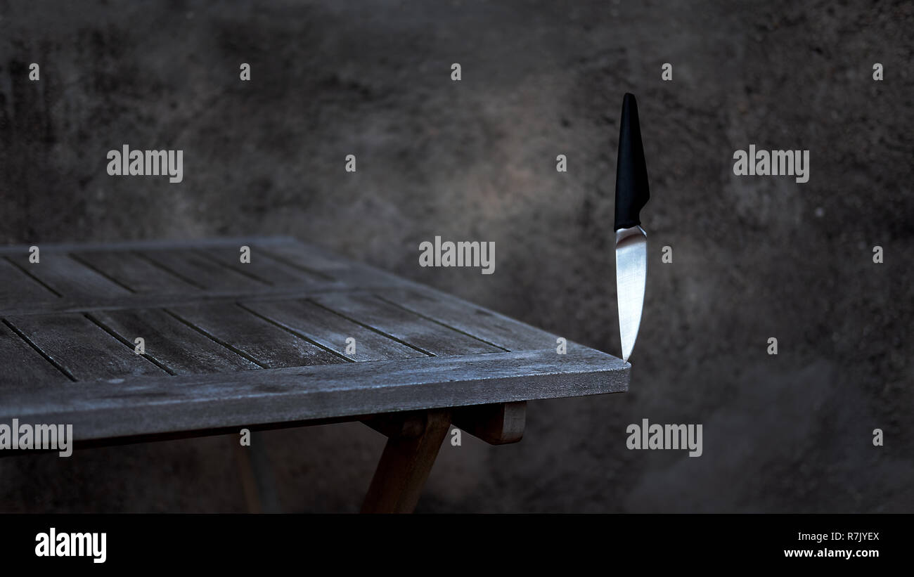 Conceptual photos of cutlery balanced on a wooden surface Stock Photo ...