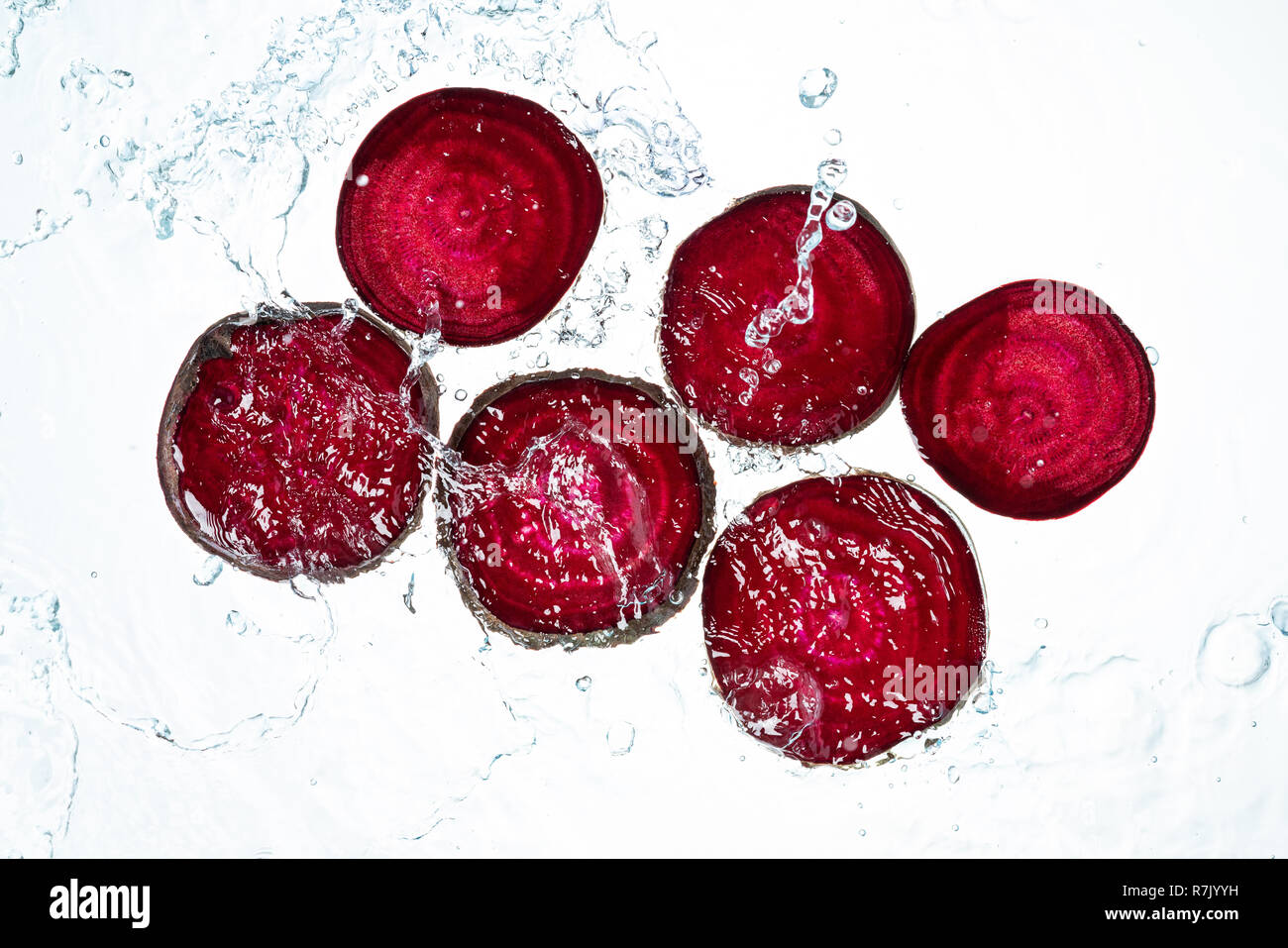 Beets Water Splash on white Background Stock Photo - Alamy