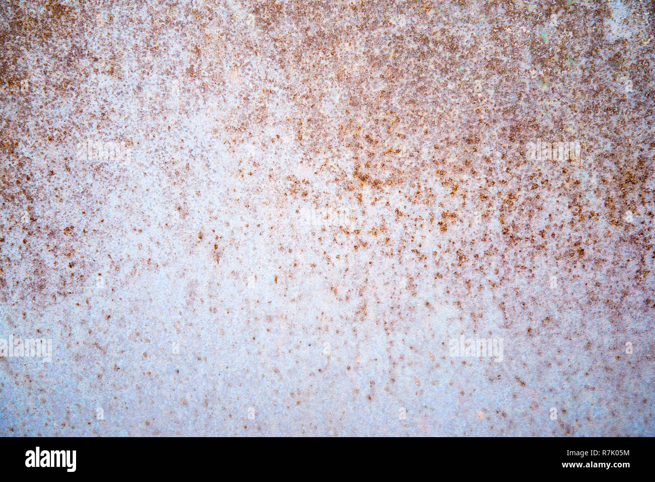 small rust stains on a light blue background Stock Photo - Alamy