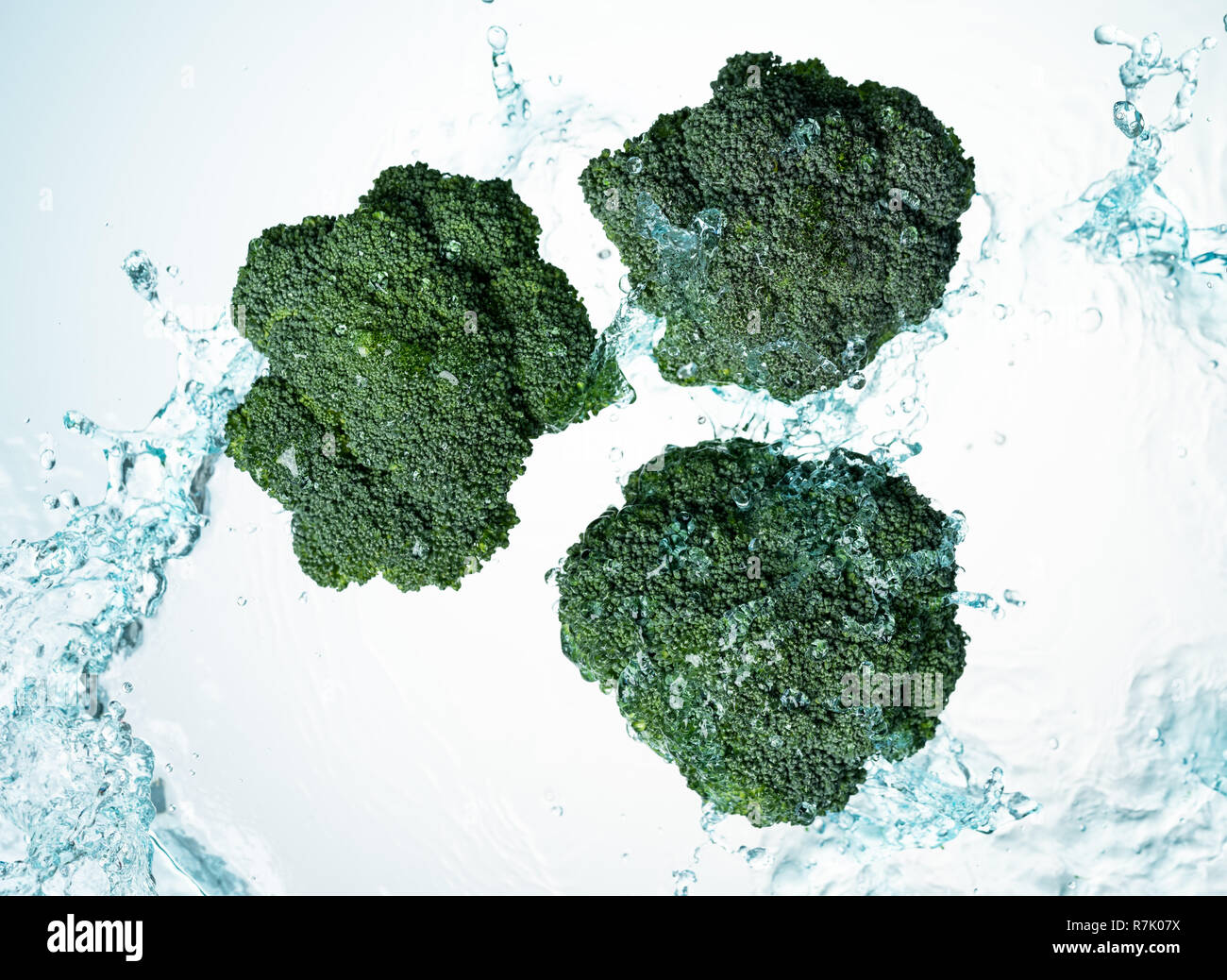 Broccoli water splash on white background Stock Photo - Alamy