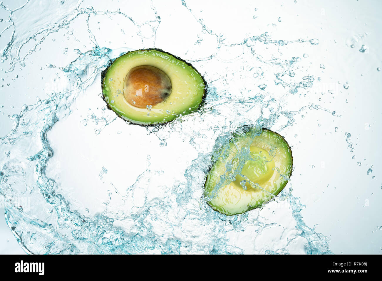 Avocado Water Splash on white background Stock Photo - Alamy