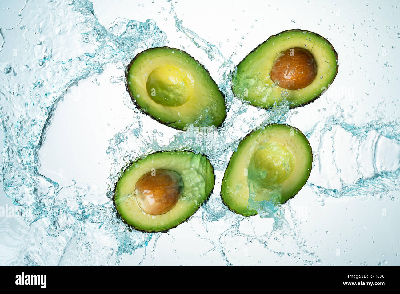 Avocado Water Splash on white background Stock Photo - Alamy