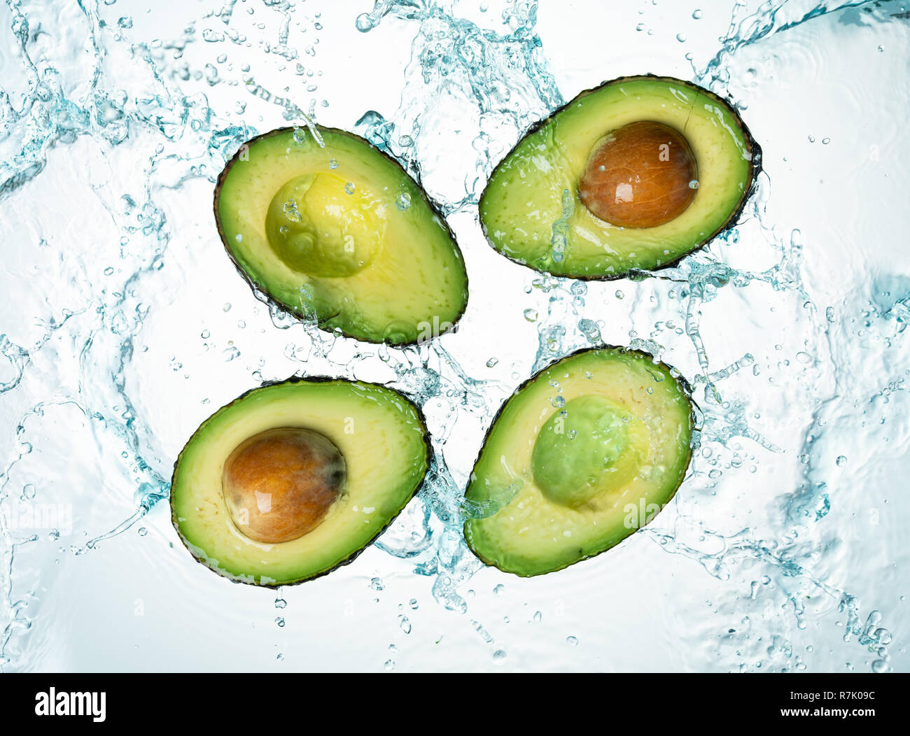 Avocado Water Splash on white background Stock Photo - Alamy