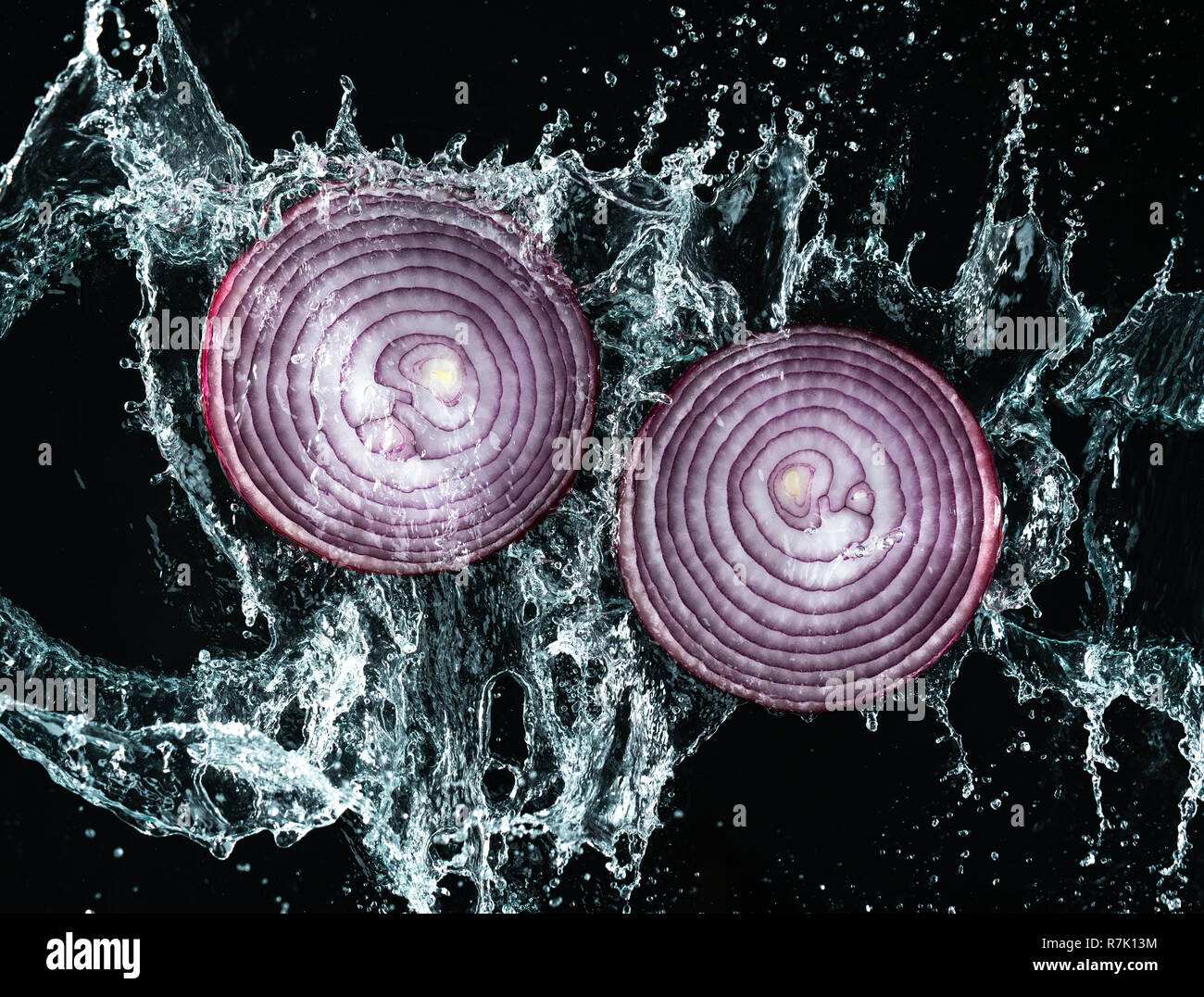 Onion Water Splash on black background Stock Photo - Alamy