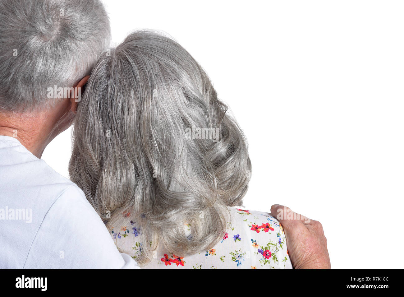 Rear view of senior couple sitting isolated Stock Photo - Alamy