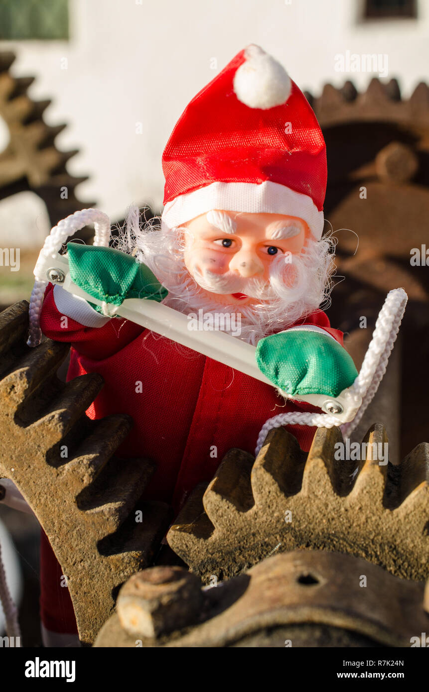 Santa in the cogwheels of consumerism, a concept Stock Photo - Alamy