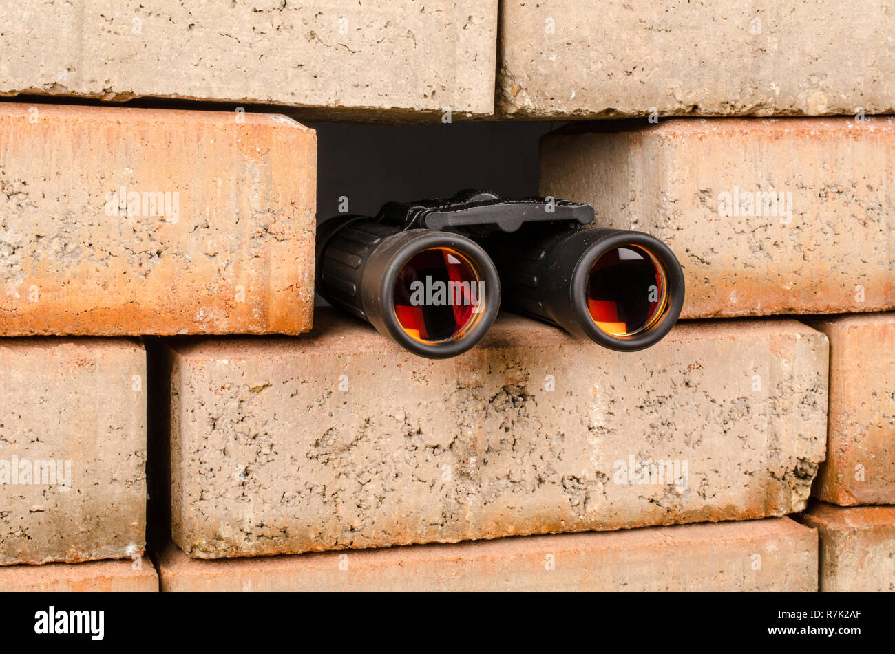 Spy glass sticking out of a wall, an immigration concept Stock Photo ...