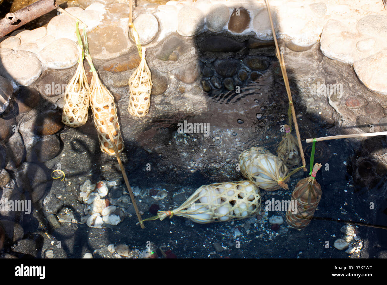Thai people and travelers foreigner cooking boiling eggs in hot spring ...