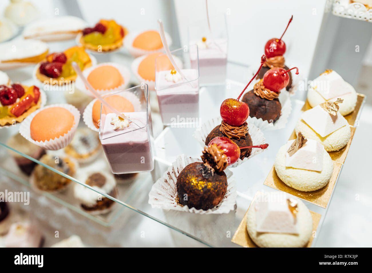 Table with different sweets for party. Candy bar Stock Photo - Alamy