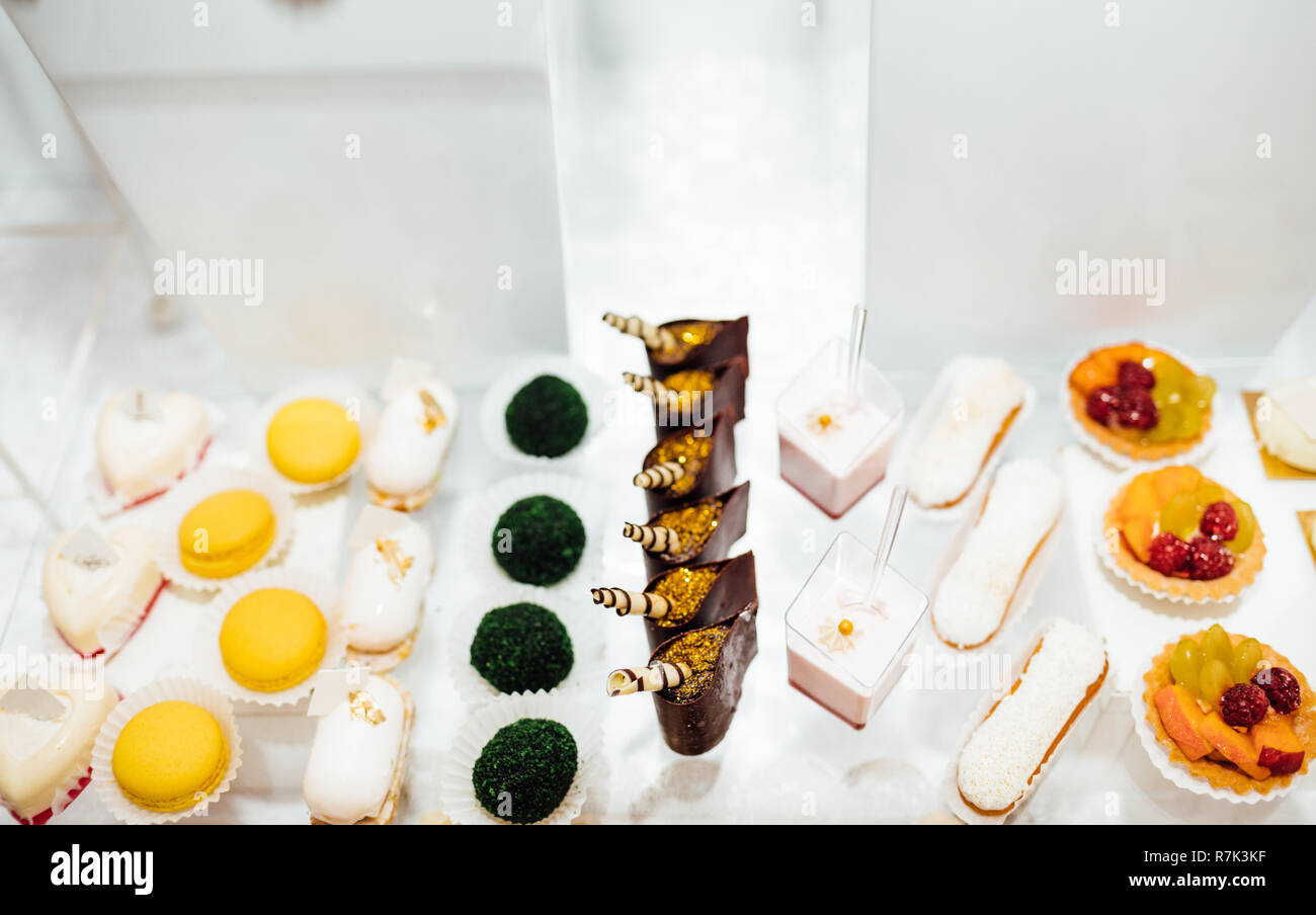 Table with different sweets for party. Candy bar Stock Photo - Alamy