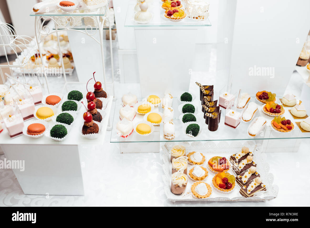 Table with different sweets for party. Candy bar Stock Photo - Alamy