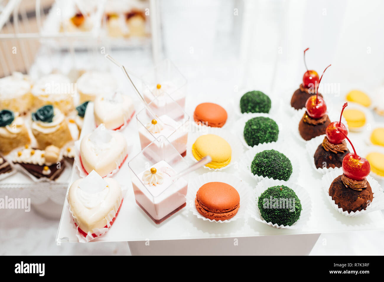 Table with different sweets for party. Candy bar Stock Photo - Alamy