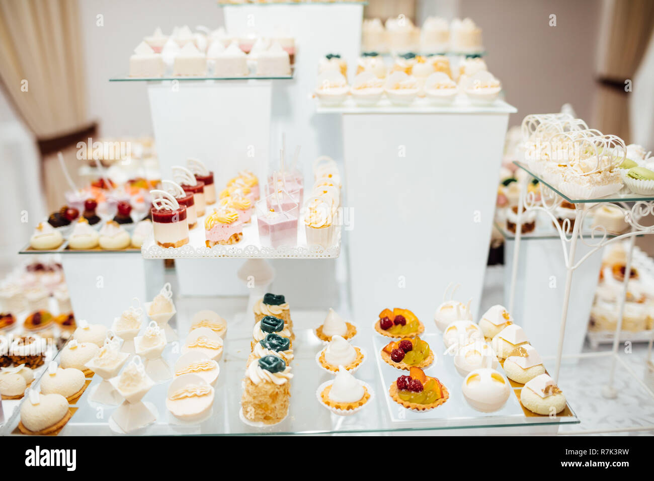 Table with different sweets for party. Candy bar Stock Photo - Alamy